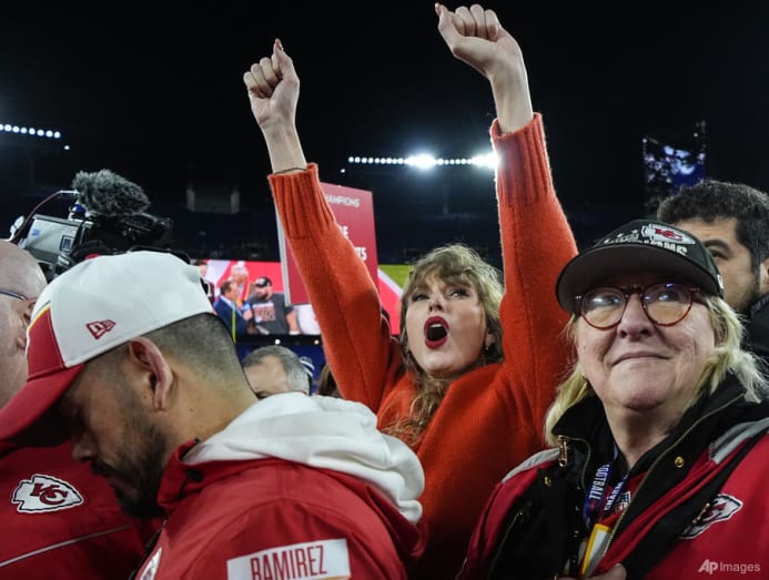 Taylor Swift greets Super Bowl-bound Travis Kelce with a kiss after Kansas City Chiefs win the ...