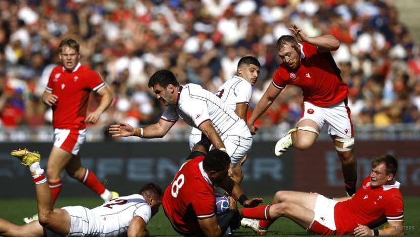 Wales see off fierce Georgia to seal top spot - CNA