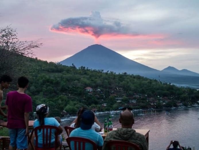 How authorities in tourist hotspots keep people safe near volcanoes ...