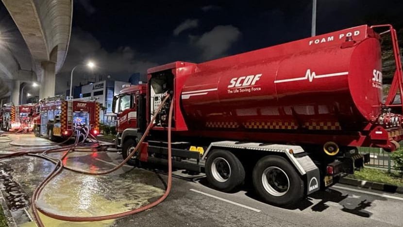 Fire engulfs Tuas factory storing chemicals, disrupting MRT services in ...