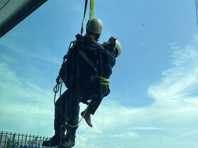 SCDF officers rescue 2 workers stranded on 40th floor of Capital Tower ...