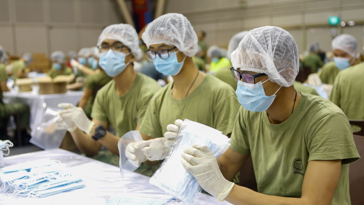 SAF personnel packing masks, doing contact tracing, supporting fight ...