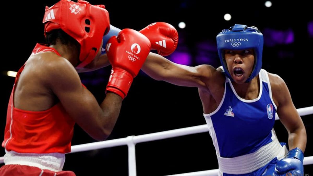 Ngamba makes history for refugee team with medal but job not done - CNA