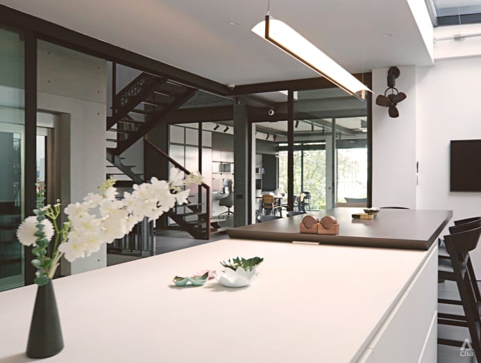 A car enthusiast’s dream house with a garage space that can fit up to ...