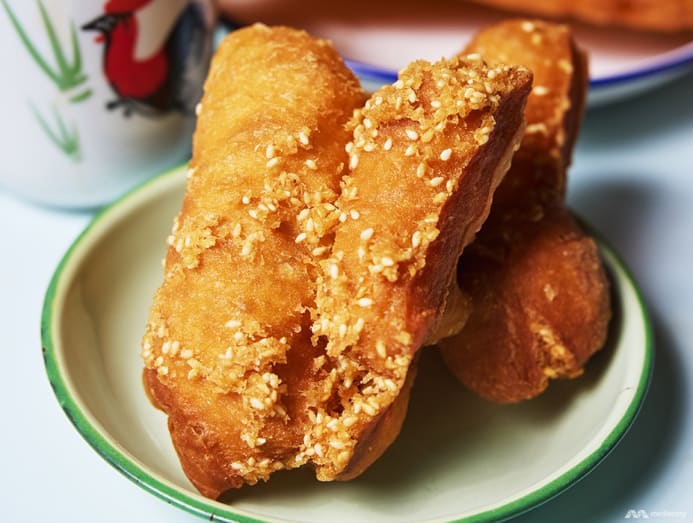 This you tiao hawker has been making these fried snacks from scratch by ...