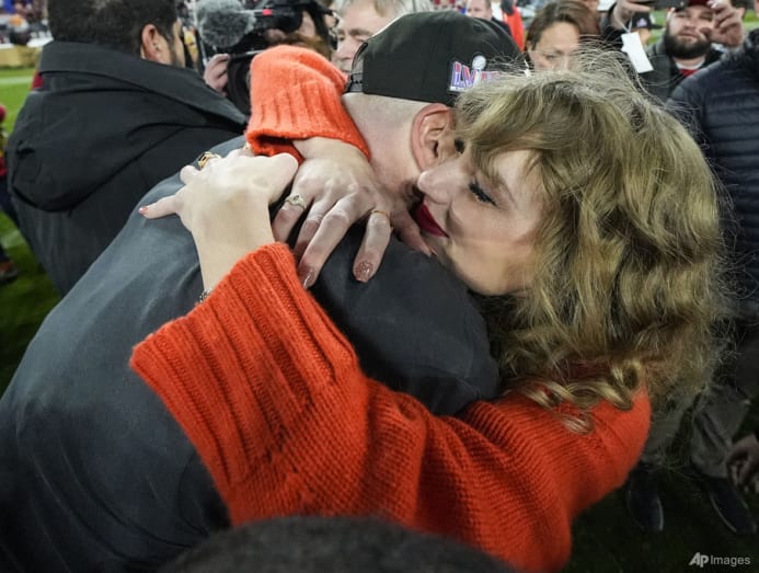 Taylor Swift greets Super Bowl-bound Travis Kelce with a kiss after Kansas City Chiefs win the ...