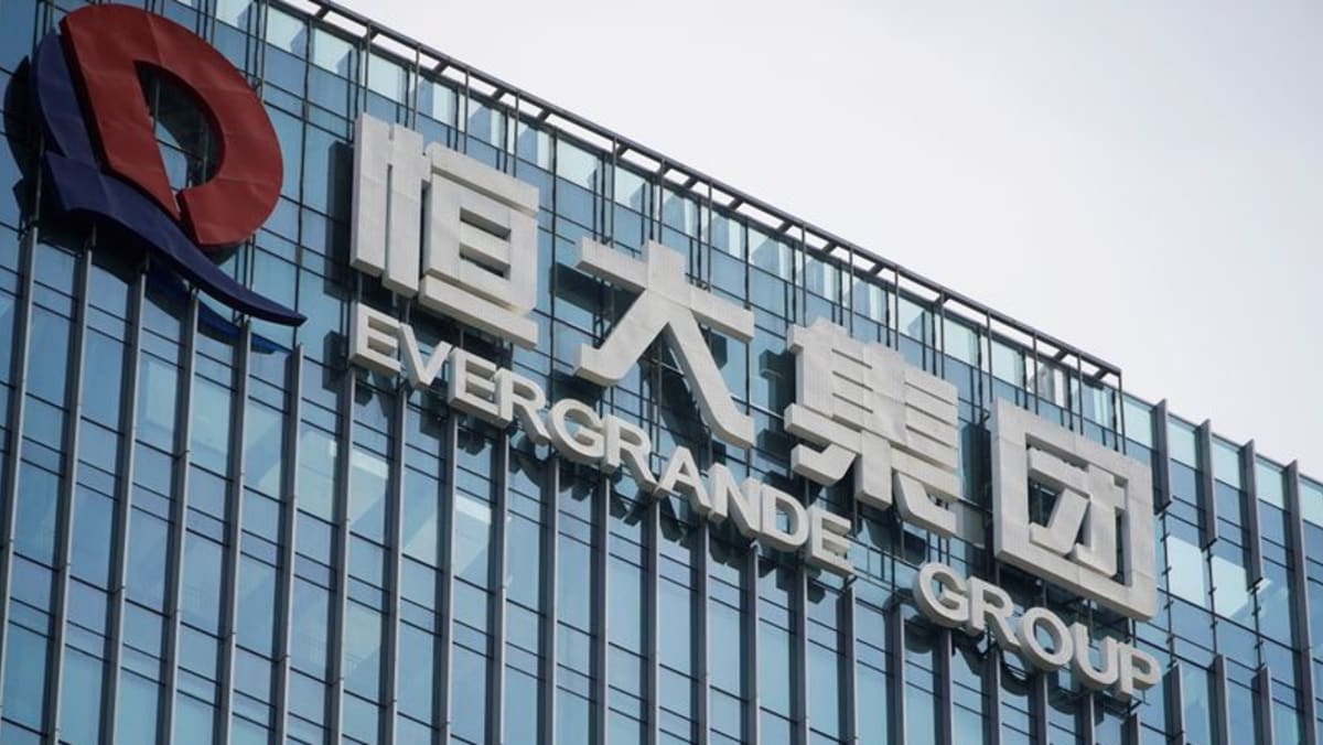 Embattled Evergrande's EV unit vows to make cars early next year - CNA