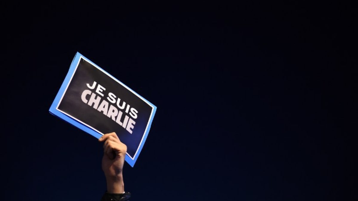 Charlie Hebdo marks anniversary edition with gun-wielding God - TODAY