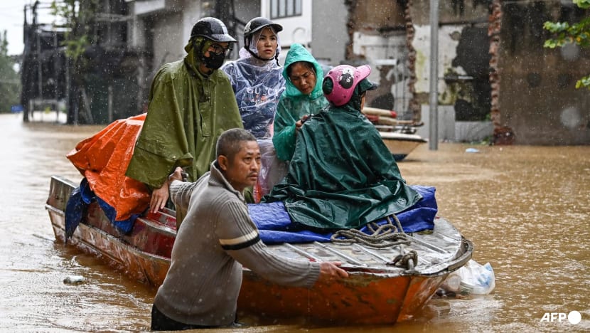 Hanoi river level hits 20-year high as SE Asia typhoon toll nears 200 - CNA