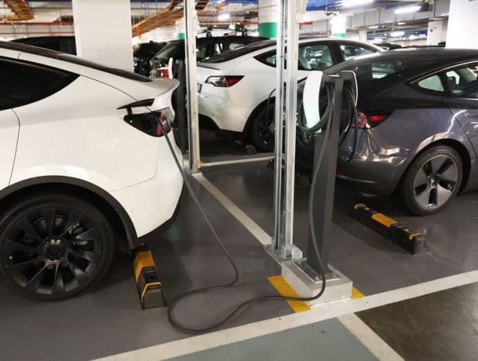 The Big Read: More drivers jumping on the EV bandwagon, but obstacles ...