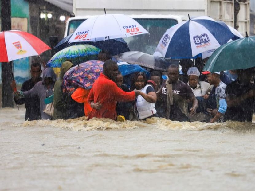 Bus passengers use rope to pull themselves to safety as floods hit ...