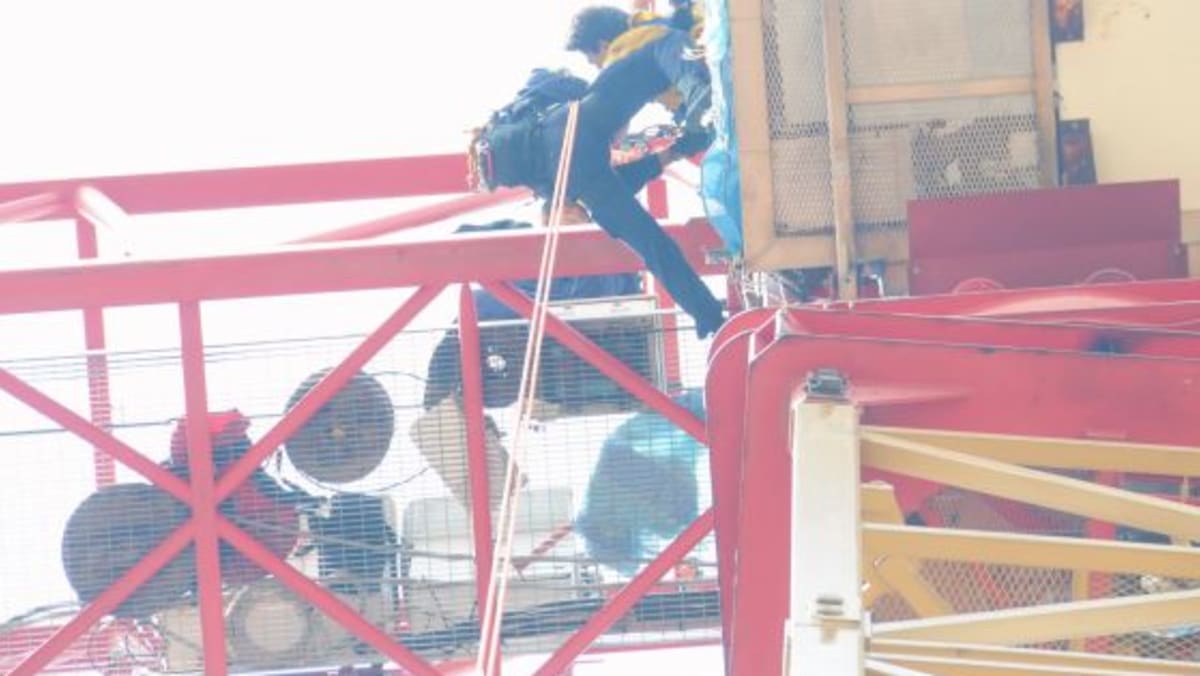 Worker feeling unwell atop 40m crane lowered to safety: SCDF - TODAY