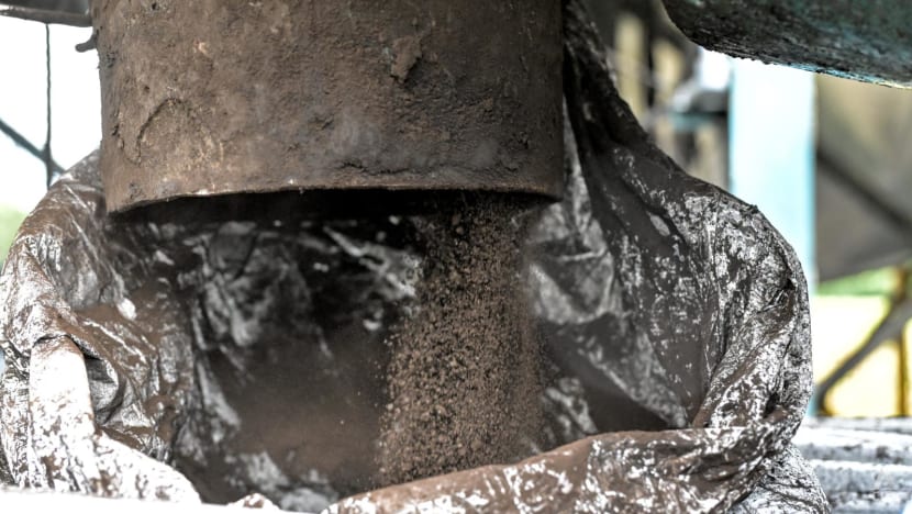 Repairing snapped booms, treating oil-slicked sand: Oil spill clean-up ...