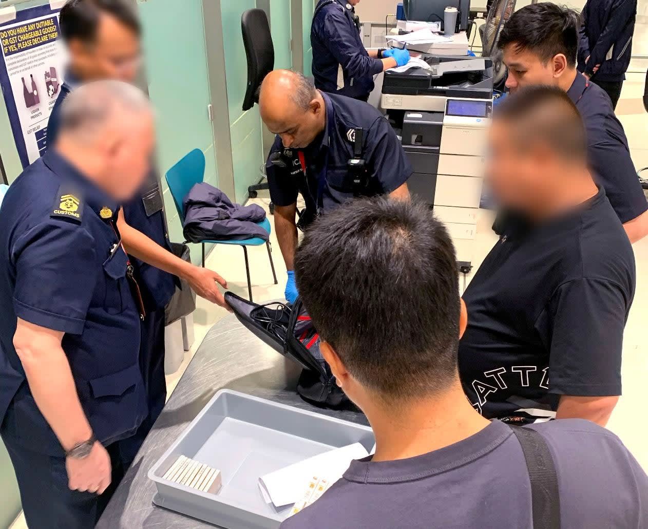 10 travellers caught at Changi Airport for carrying over S$20,000 into ...