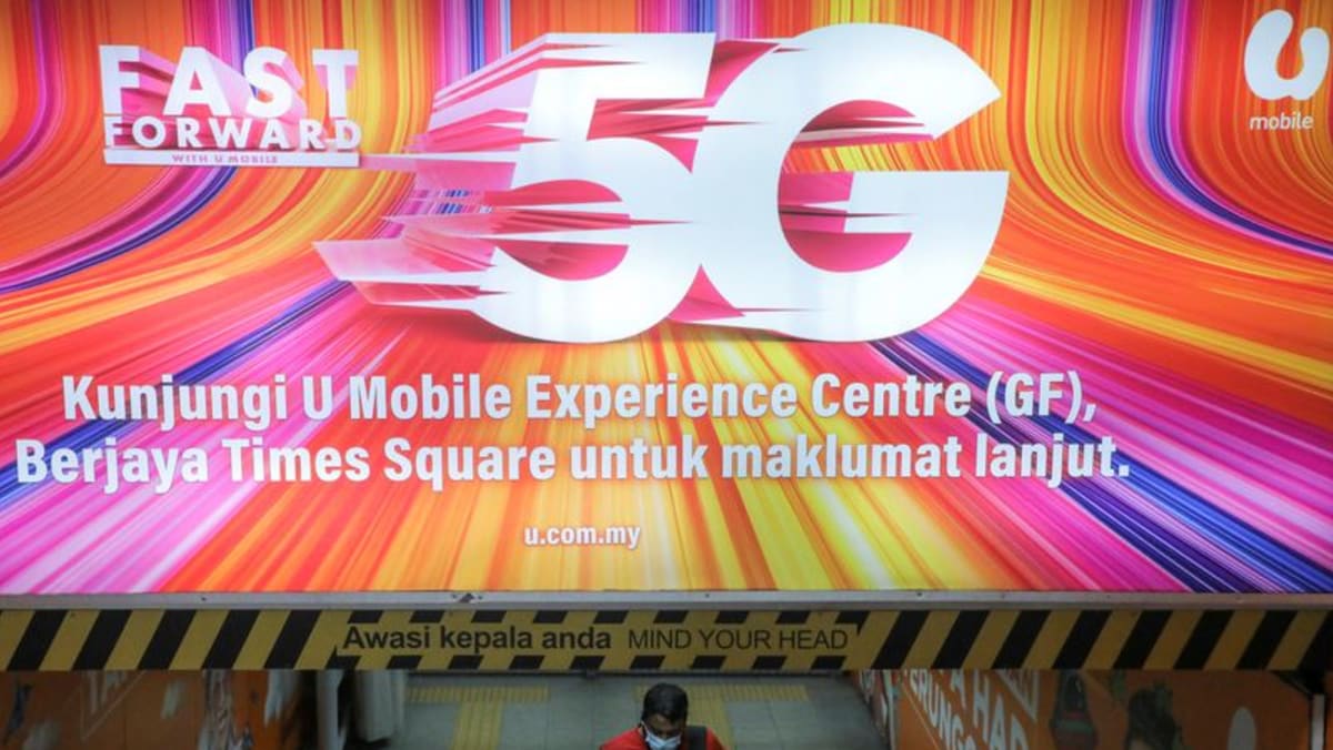Five Malaysian telcos agree to use state 5G network - CNA