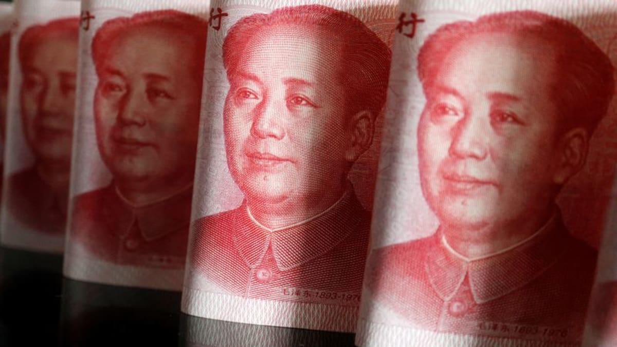 Investment banks rush to cut yuan forecasts, 7 per dollar at risk - CNA