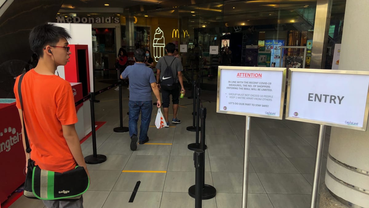Safe distancing: Shoppers adjust to queues, floor markers as mall ...