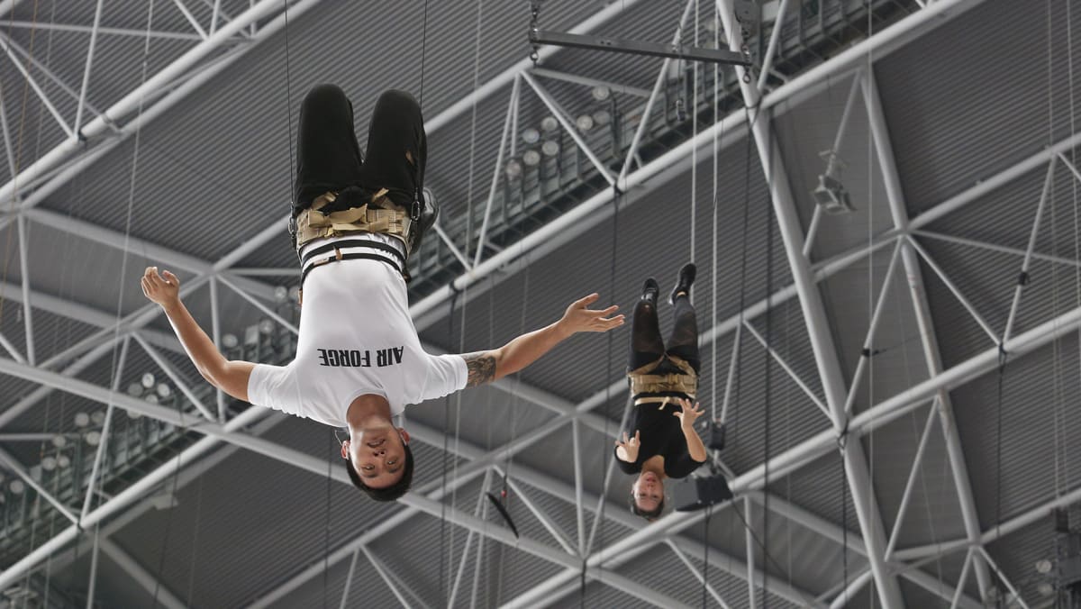 Aerialists soldier on through dizziness, discomfort during NDP practice ...