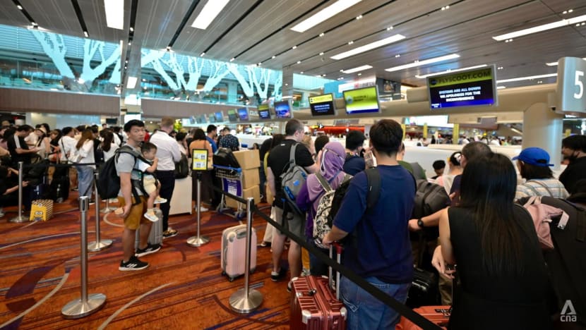 Long queues, frustrated passengers at Changi Airport after some airlines' systems go down in ...