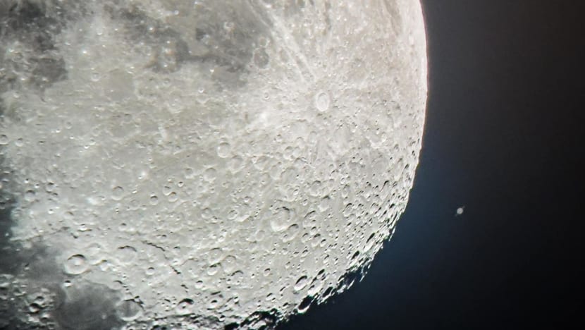 In pictures: Saturn seen cosying up to the moon in rare conjunction - CNA