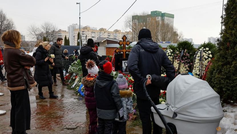 Russians lay flowers at Navalny's grave, hail him as symbol of hope - CNA