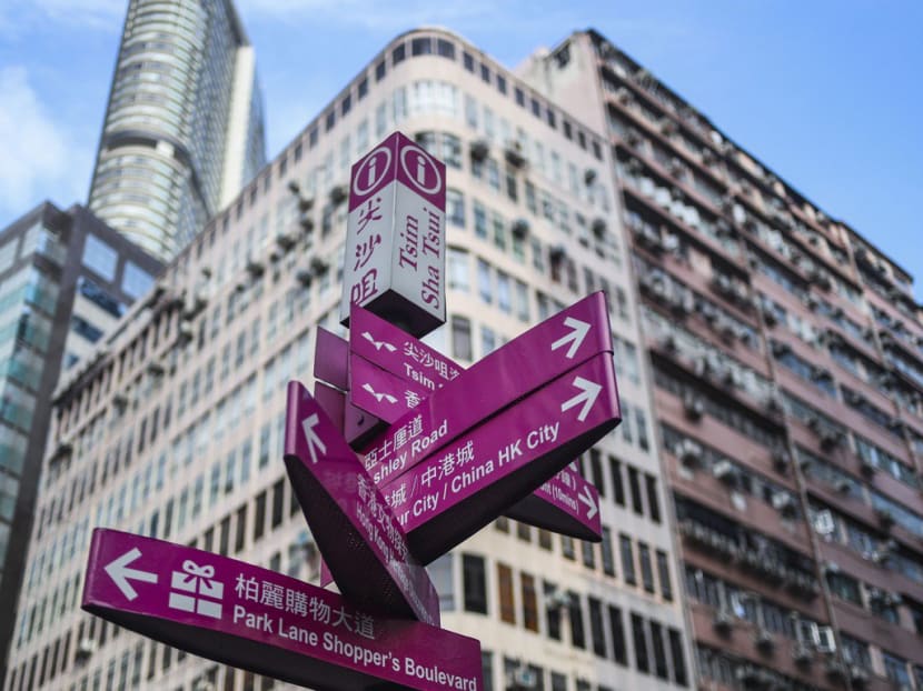 British-style street signs show walking distances in Hong Kong as city ...