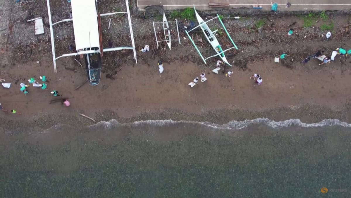Philippine diving town swaps trash for rice to clean up its beaches - CNA