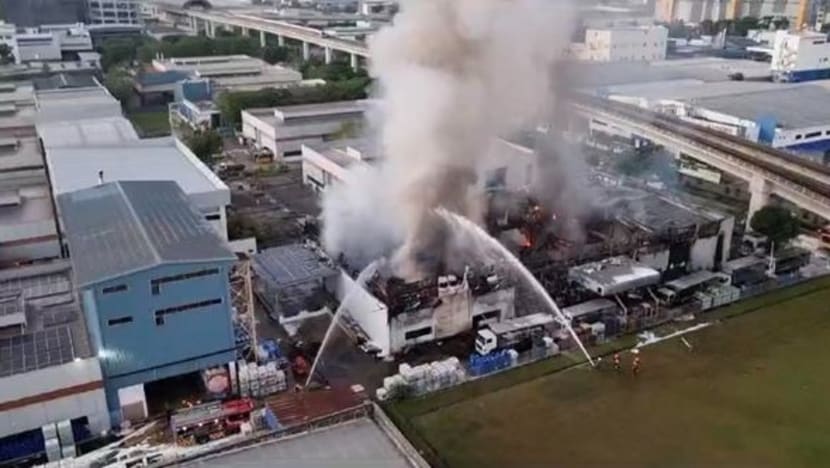 Fire engulfs Tuas factory storing chemicals, disrupting MRT services in ...