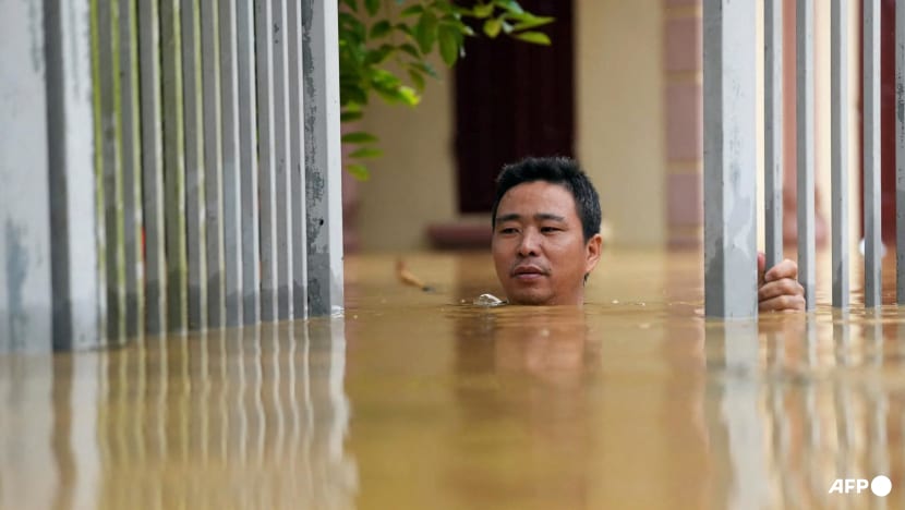 Hanoi river level hits 20-year high as SE Asia typhoon toll nears 200 - CNA