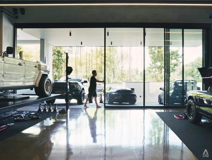 A car enthusiast’s dream house with a garage space that can fit up to ...