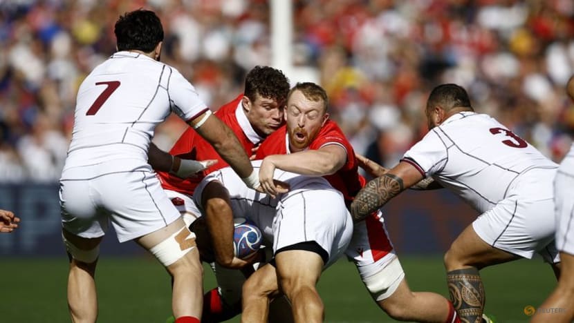 Wales see off fierce Georgia to seal top spot - CNA