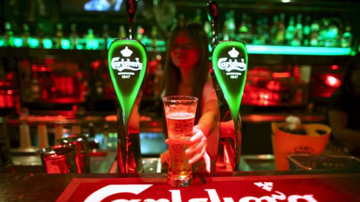 Malaysians back beer promoter who kept her cool despite racial ...