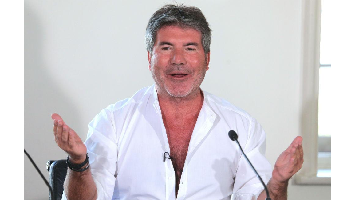 Simon Cowell saves dogs - 8days